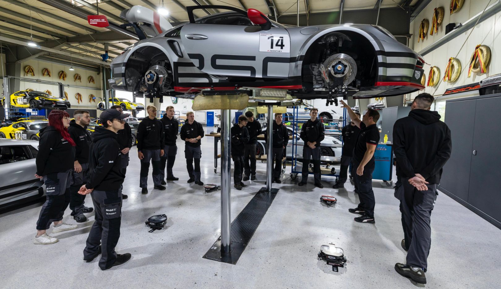Learning by doing: apprentices in the Porsche Carrera Cup Deutschland ...